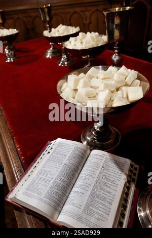 Protestant church. Bible, vine and bread on altar. Communion in memory ...