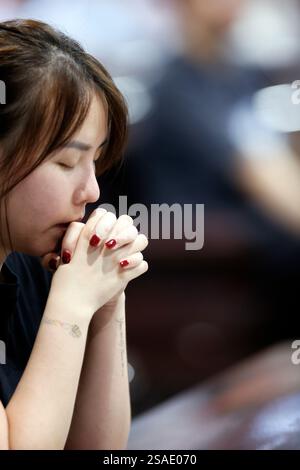 Tan Hoa Church. Sunday catholic mass. Priest giving holy communion. Ho ...