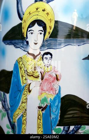 Basilica of Our Lady of La Vang. Our Lady of La Vang holding a figure ...