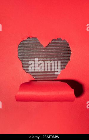 Heart shaped red torn paper. Burst hole background. Minimal abstract ...