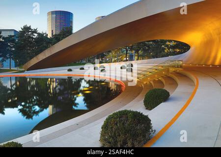 illuminated Porsche pavilion in the evening in the Autostadt, Germany ...
