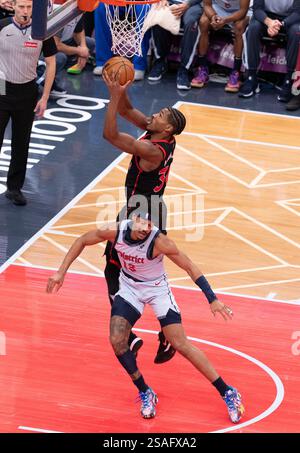Toronto Raptors' Ochai Agbaji (30) is guarded by Brooklyn Nets' Maxwell ...