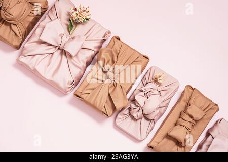 Fabric wrapped gift boxes arranging in a row Stock Photo - Alamy