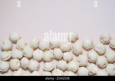 Frozen dumplings on neutral background with copy space Stock Photo - Alamy