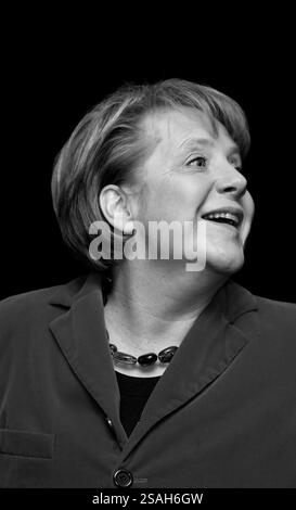 Former German Chancellor Angela Merkel, gestures as she is introduced ...
