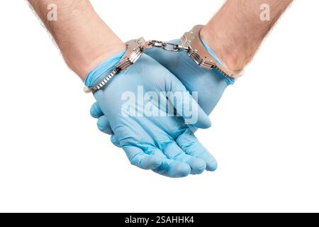 male hands in handcuffs and medical glove on white background, concept ...