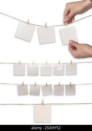 collection of various notes and a clothes pegs on white background ...