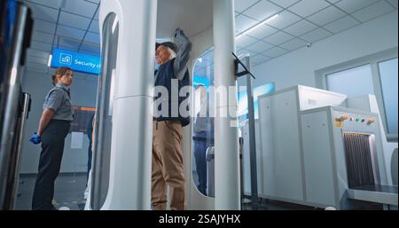 Diverse People Passing Through Metal Detector Gates in Airport Terminal ...