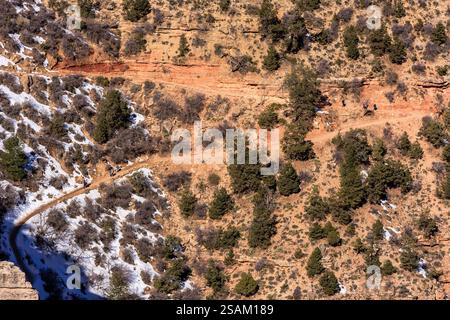 An aerial view of rocky path surrounded by greenery fields and ...
