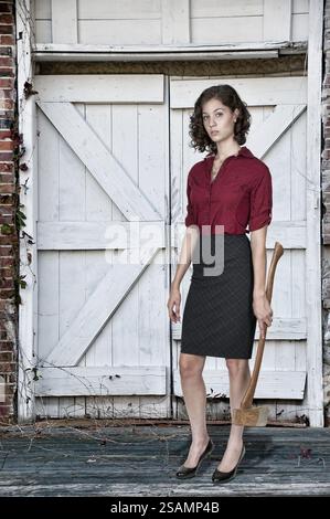 Beautiful possessed woman in a trace holding an axe Stock Photo - Alamy