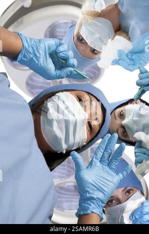 Beautiful young women surgeons performing a surgery Stock Photo - Alamy