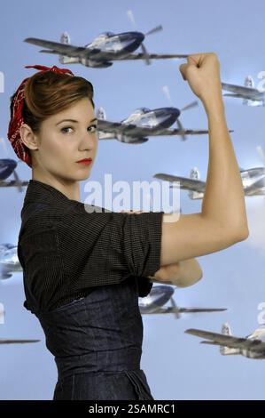 Beautiful woman dressed as the iconic Rosie the Riveter Stock Photo - Alamy