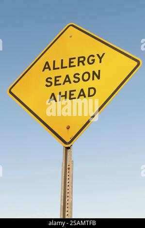 Yellow allergy season ahead highway road sign Stock Photo - Alamy
