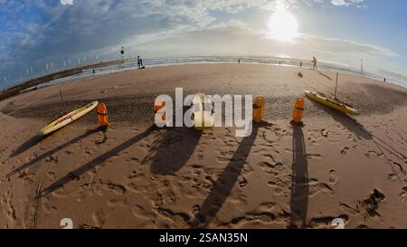Lifeguard rescue paddle boards and swimming bouys on beach waters edge ...