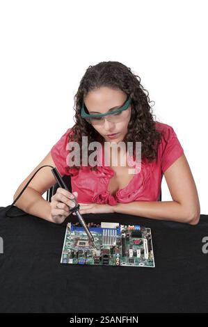 Beautiful woman repair soldering a printed circuit board Stock Photo ...