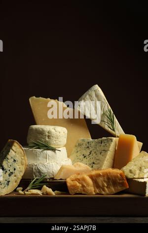 Blue cheese and various types of cheese with rosemary and tomatoes on ...