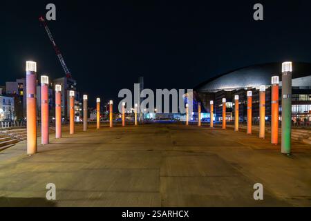 The Wales Millennium Centre illuminated with colorful lights at night ...