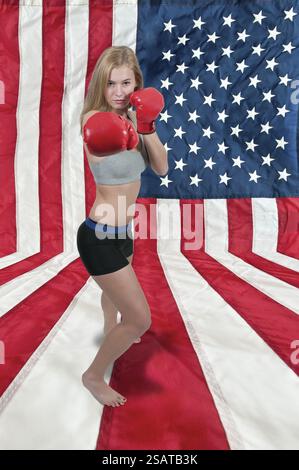 Young beautiful fit athlete woman looking at smartphone with music ...