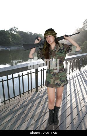 Beautiful young woman soldier with a M16 rifle Stock Photo - Alamy