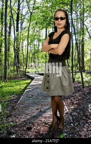 Beautiful middle age hispanic woman at the city street on a sunny day ...