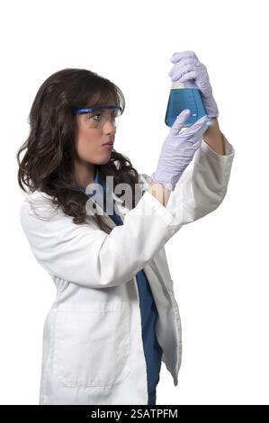 Beautiful woman scientist investigating a glass beaker Stock Photo - Alamy
