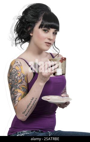 Beautiful women having a social tea party Stock Photo - Alamy