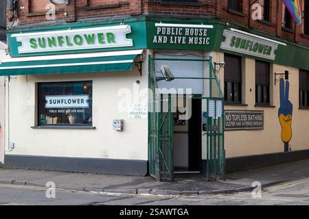 the sunflower public house corner pub with old security gate still ...