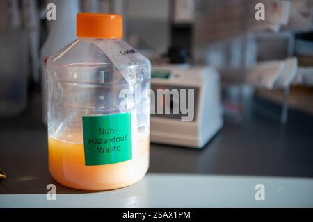 Non-hazardous waste orange liquid gallon plastic jug science lab Stock ...