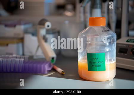 Non-hazardous waste orange liquid gallon plastic jug science lab Stock ...