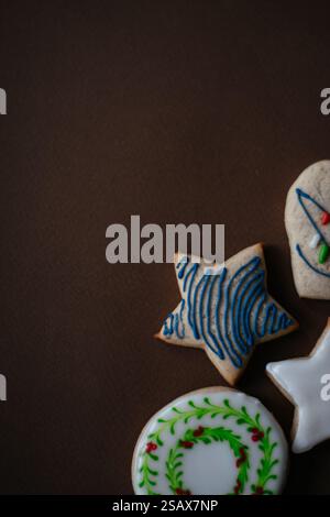 Different shapes of gingerbread cookies on wooden table. New year Stock ...