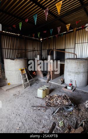 Mezcal is fermented and distilled in copper still tanks in artisanal ...