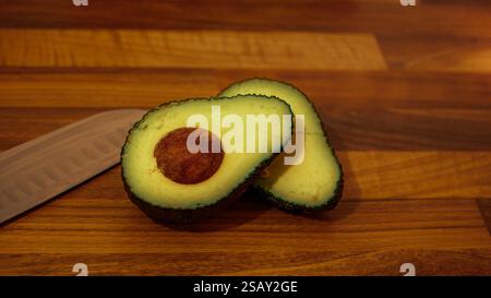Avocado in stages of being prepared, close up skin textures Stock Photo ...