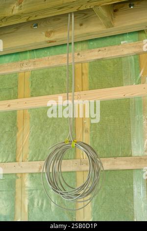 The first fix by electricians in wiring a property. Coiled wire ready ...