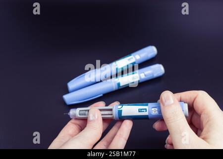 Ozempic Insulin injection pen on a dark background for diabetics and weight loss Stock Photo - Alamy