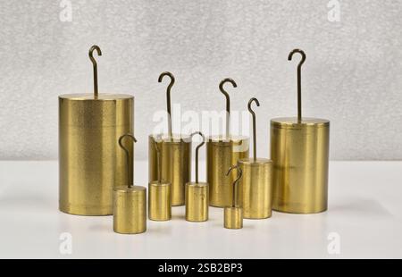 Brass hooked weights scientific laboratory measuring equipment isolated ...
