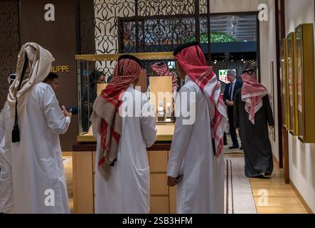 DOHA JEWELLERY AND WATCHES EXHIBITION People visit and look at gold and ...