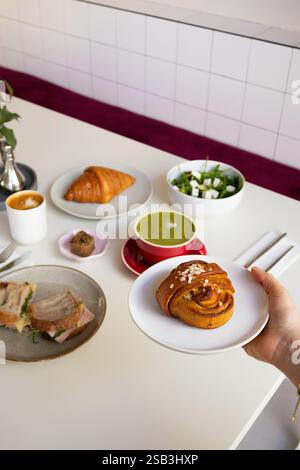 Selection of food, drink and pastries served at a coffee shop Stock ...