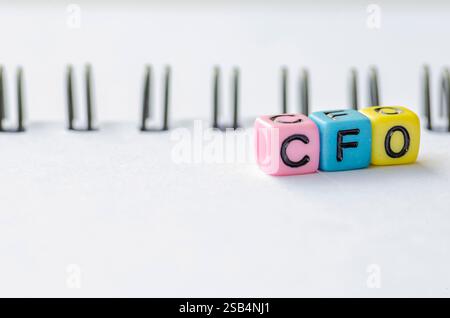 CFO text on colorful plastic alphabet beads representing Chief ...