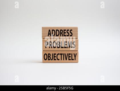 Address Problems Objectively symbol. Wooden blocks with words Address ...