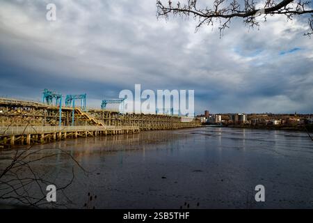 Exposed mud of the tidal lagoon at Dunston Staithes, Newcastle, England ...