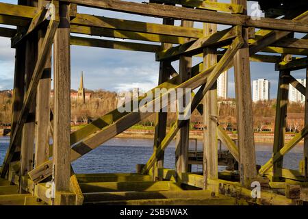 Elswick riverside viewed through the wooden trestle structure of the ...