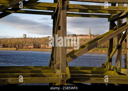 Elswick riverside viewed through the wooden trestle structure of the ...