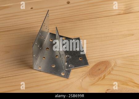 metal corner with holes for connecting wooden parts with screws, metal ...
