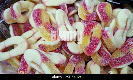 Multi-colored long jelly candies in the store Stock Photo - Alamy