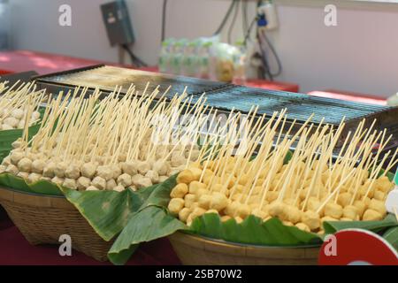 vibrant display of traditional grilled meatball skewers neatly arranged ...