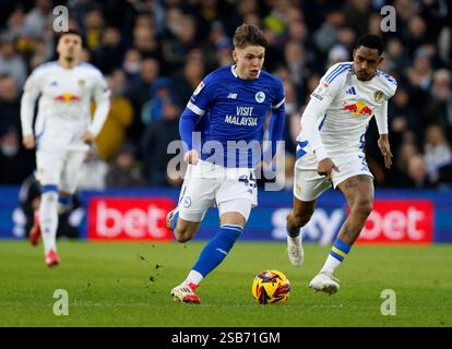Cardiff City's Cian Ashford (left) and Leeds United's Junior Firpo ...