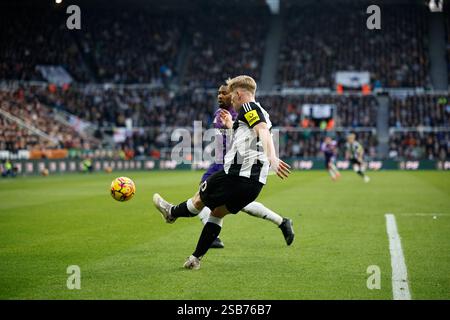 Lewis Hall of Newcastle United clears the ball during the Premier ...