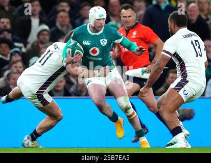 Ireland's Hansen Mack, centre, is tackled by Italy's Martin Page-Relo ...