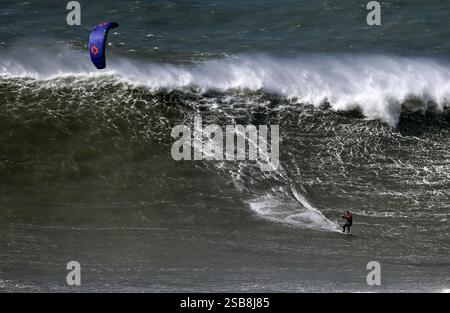 NAZARE, PORTUGAL - JANUARY 30: James Carew of Australia is kitesurfing ...