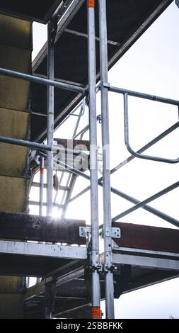 Sun shines through scaffolding Stock Photo - Alamy